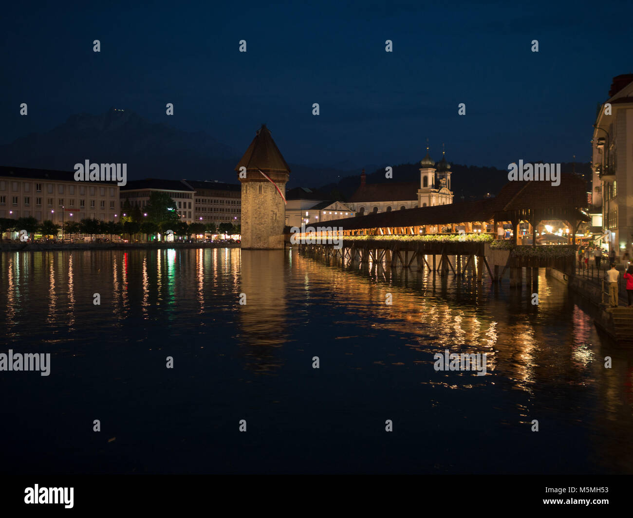 Luzern Chapel Bridge reflected in Reuss river at night Stock Photo - Alamy