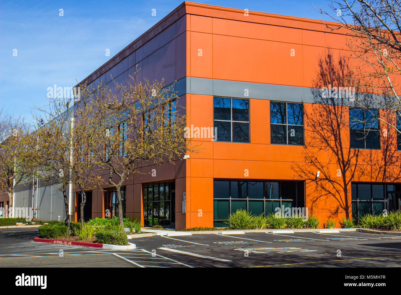 Colorful Orange Office Building Stock Photo - Alamy
