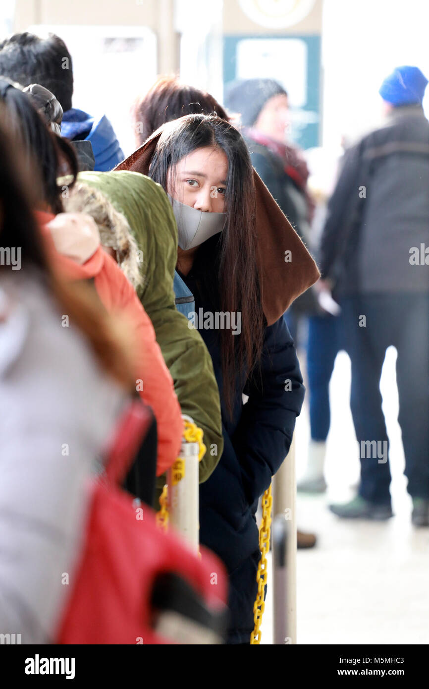Teenage girl waiting to queue Stock Photo - Alamy