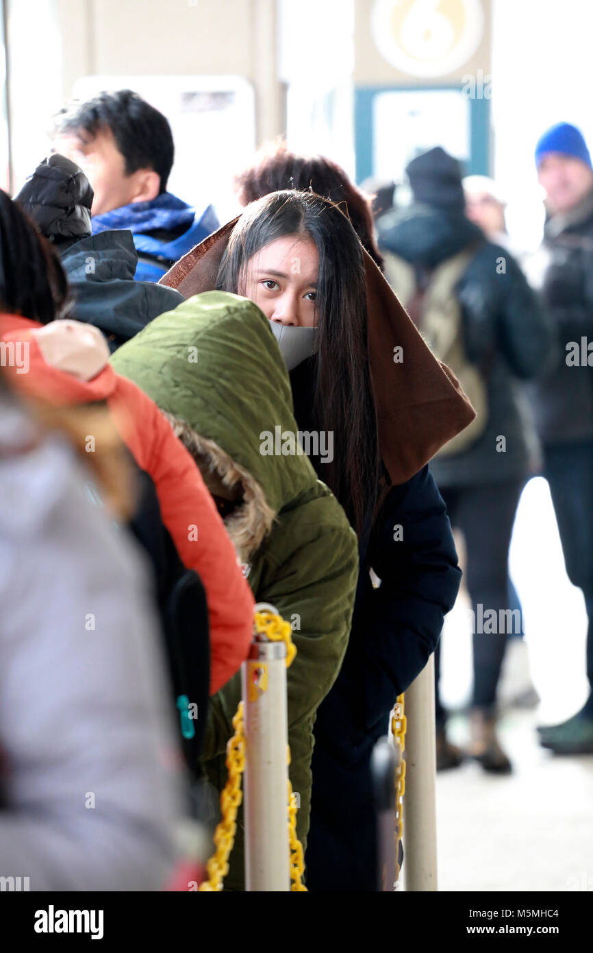 Teenage girl waiting to queue Stock Photo - Alamy