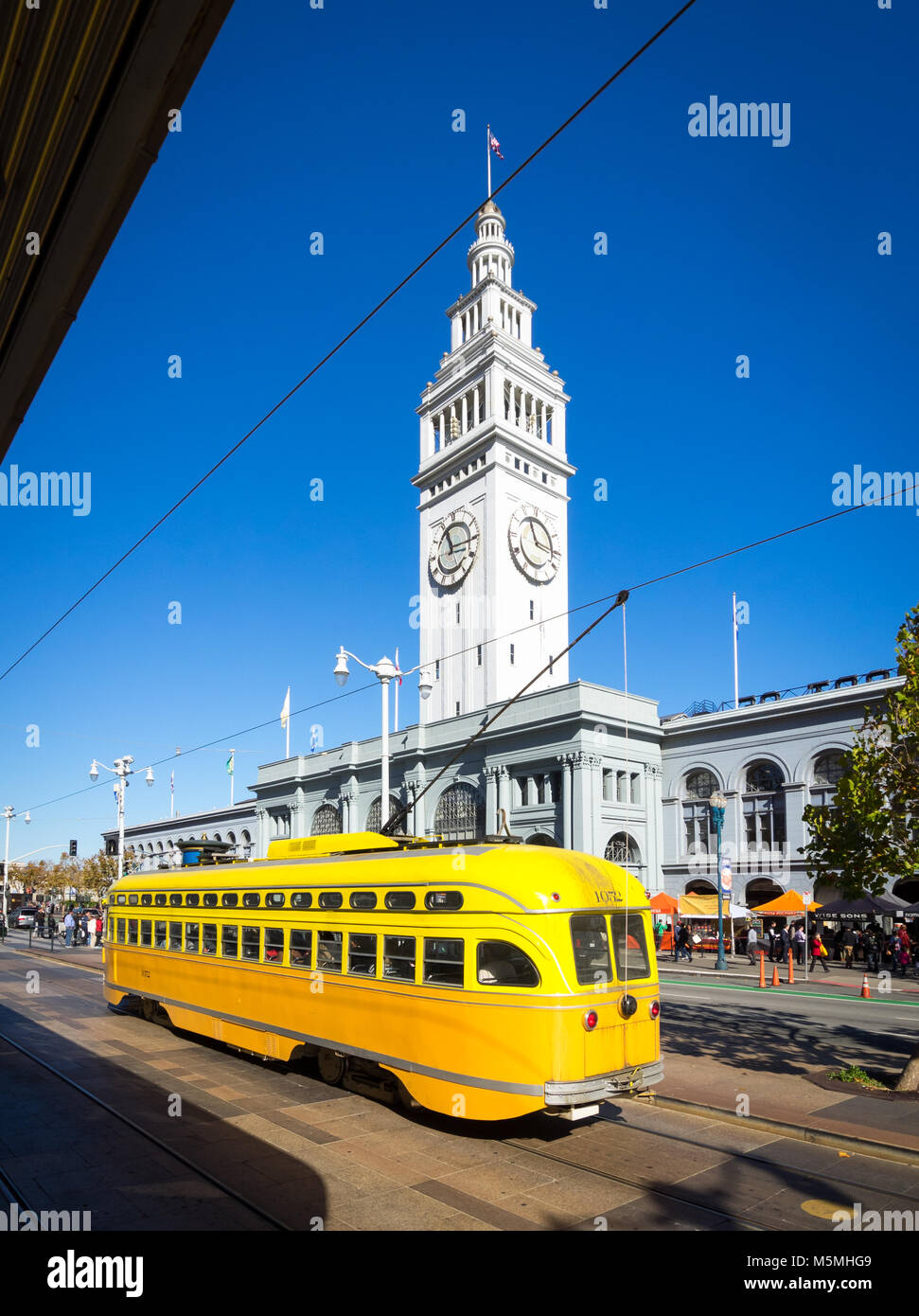 The historic, F-line streetcar in front of the Ferry Building along the ...