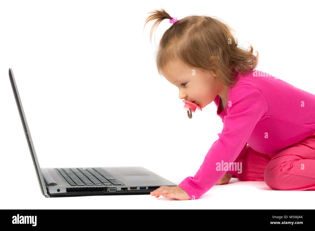 Portrait of a beautiful little girl with a computer. Child with laptop ...