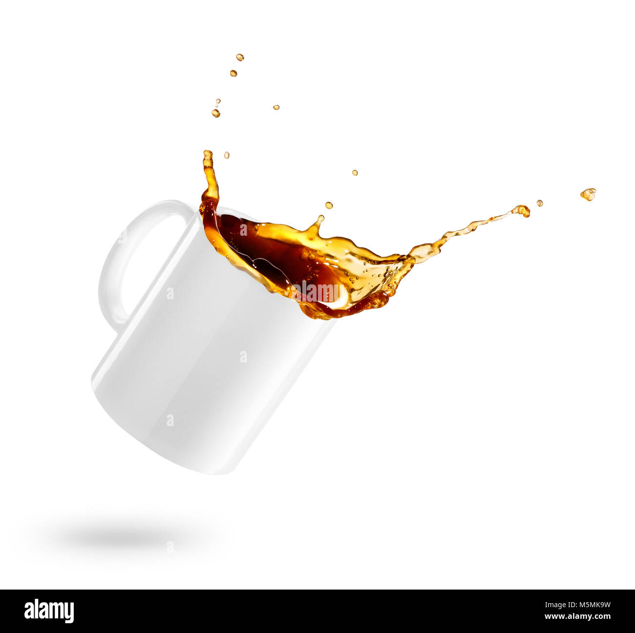 mug of spilling coffee or tea isolated on white background. Coffee ...