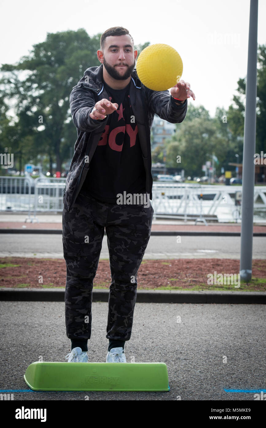 Playing curb ball. Dutch Championship Stock Photo - Alamy