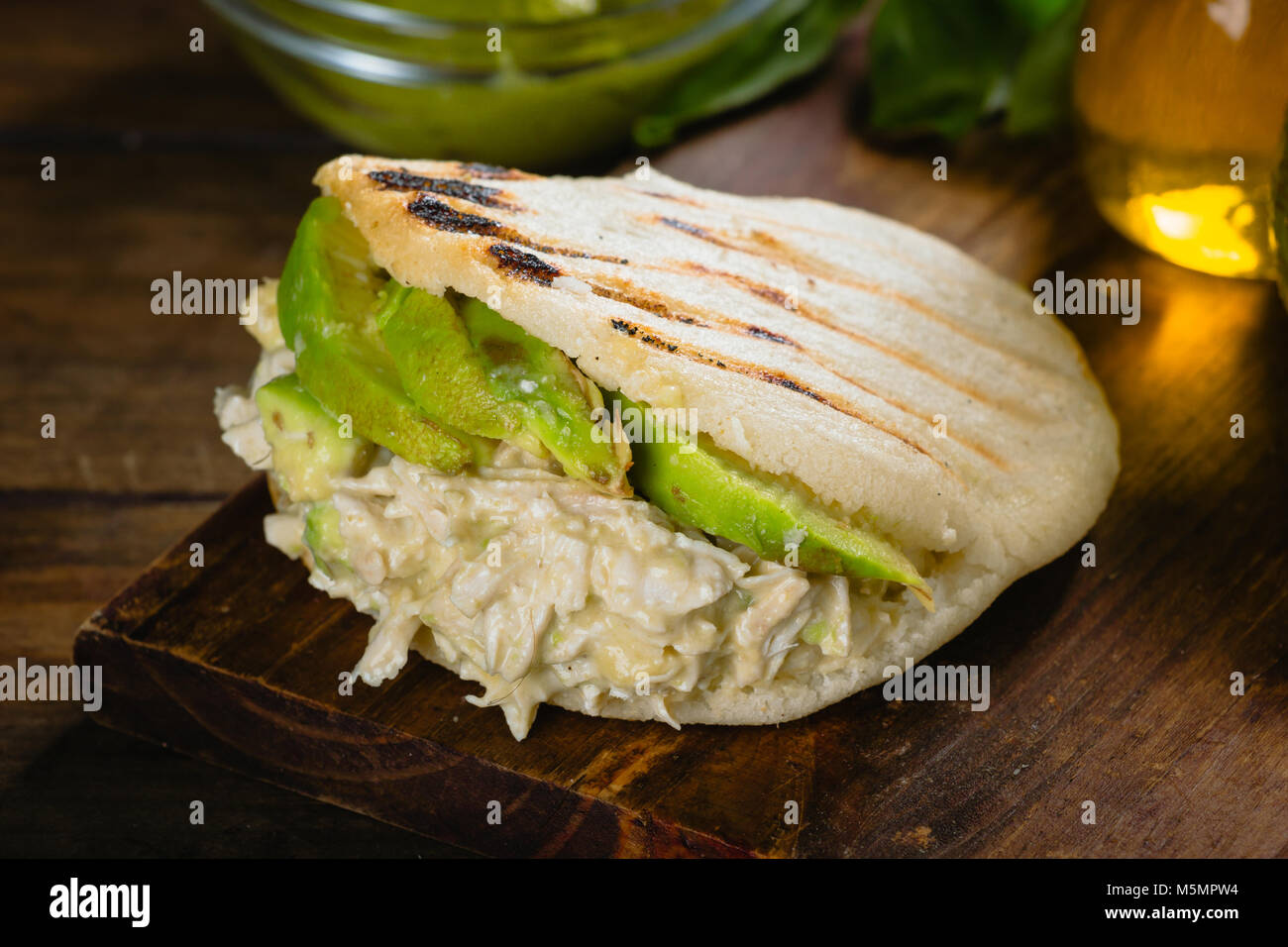 Reina pepeada, Arepa, corn bread with chicken and avocado Stock Photo ...