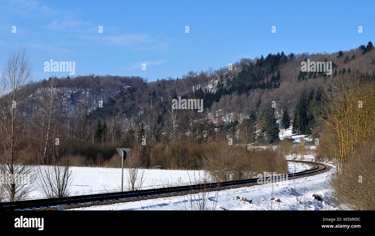 winding railroad tracks in winter landscape Stock Photo - Alamy