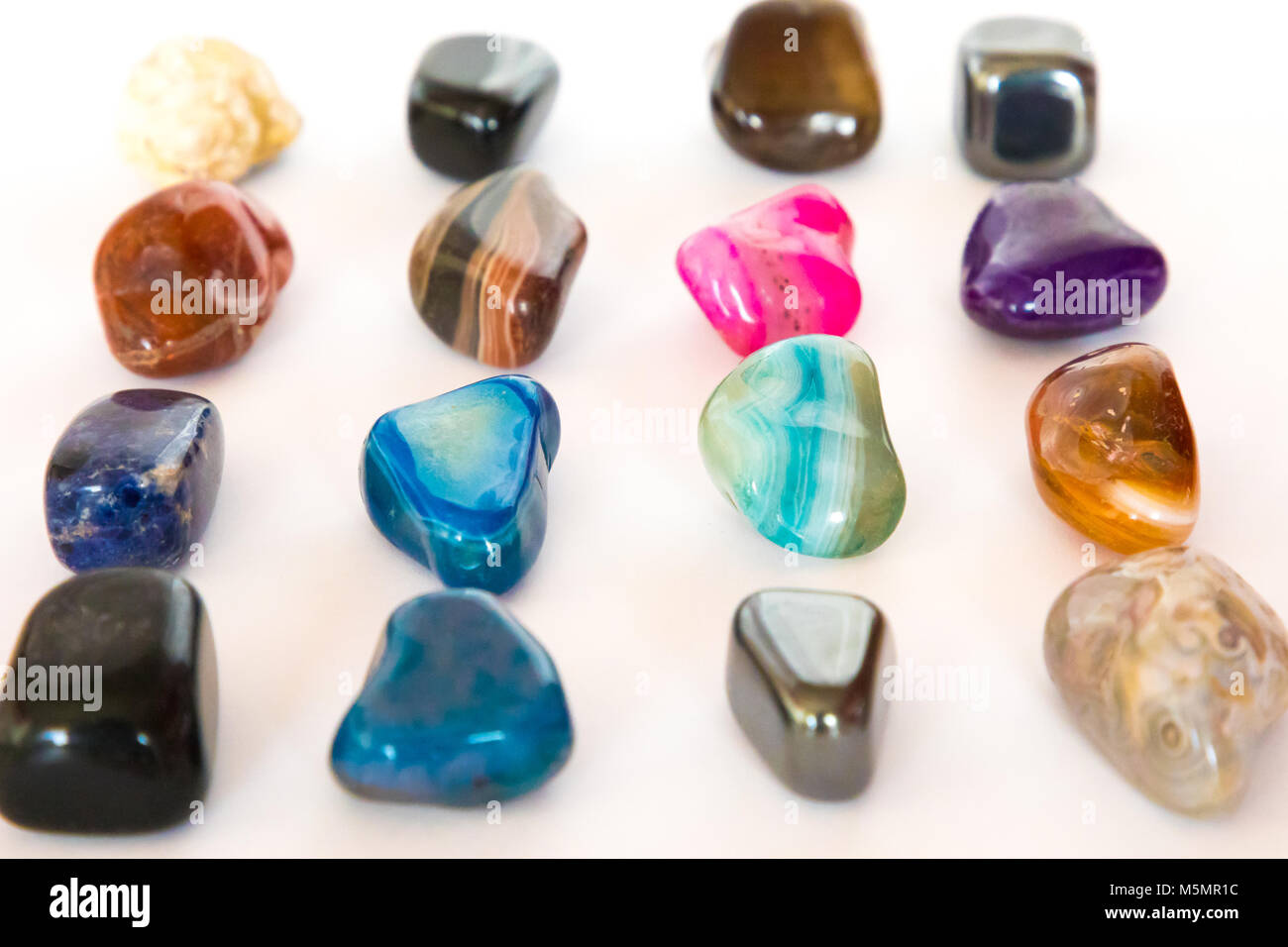 Collection of colorful semiprecious gemstones on white background Stock ...