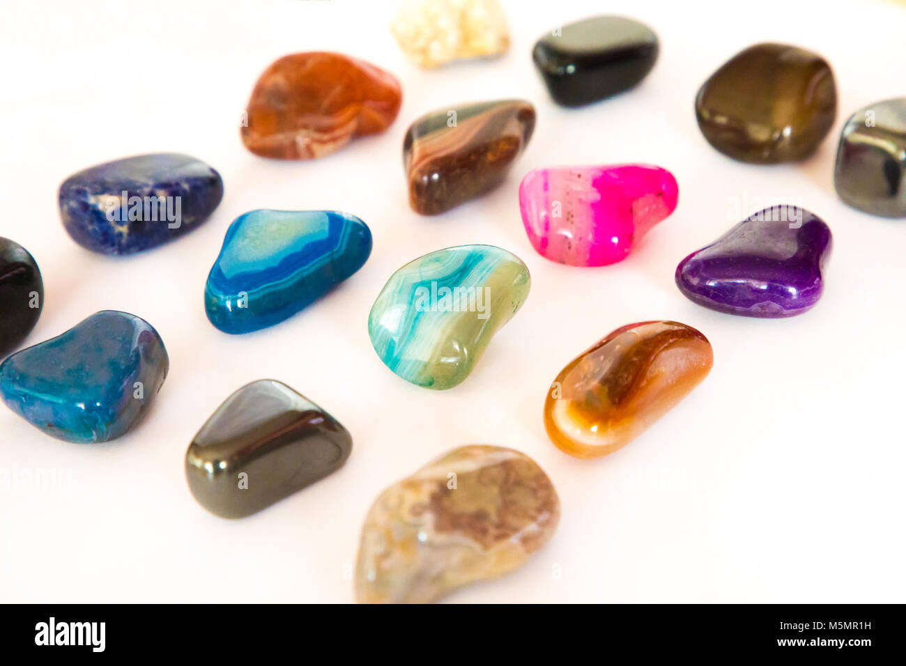 Collection of colorful semiprecious gemstones on white background Stock ...