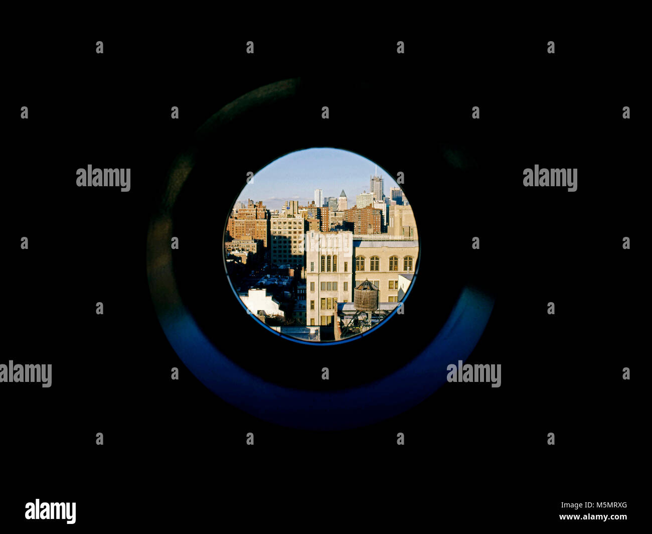 A view of NYC skyline from a circular window Stock Photo - Alamy