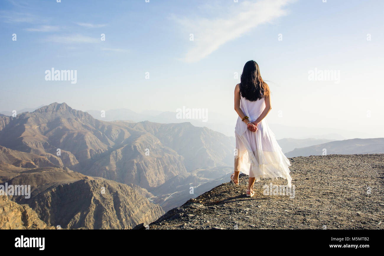 Female standing on mountain peak hi-res stock photography and images ...