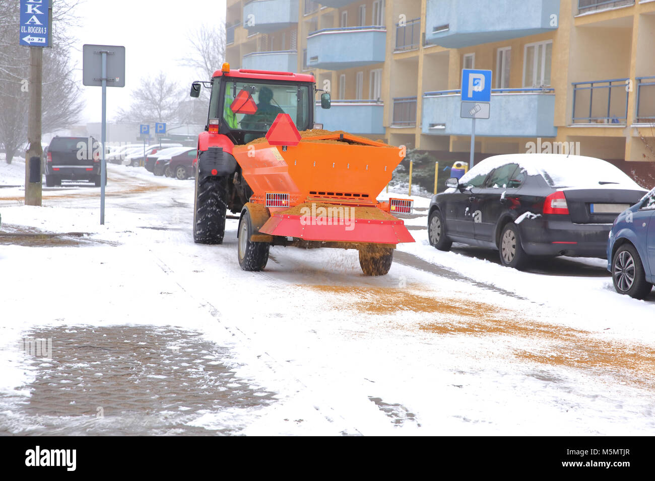 Tractor with an automatic trailer for spreading sand on roads Stock ...