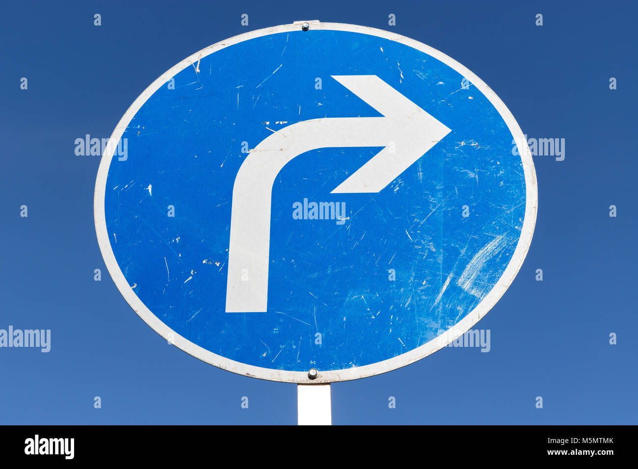 German road sign: turn right ahead Stock Photo - Alamy