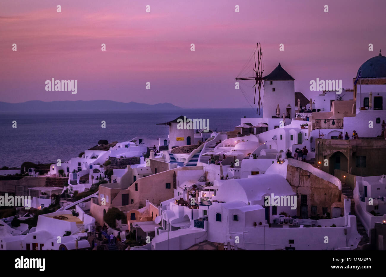 Sunset colors on the Cyclades Santorini island in Greece Stock Photo ...