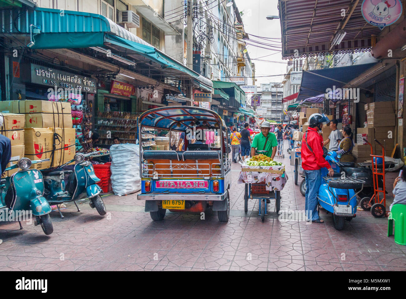 Typical Chinatown street, tuk-tuk, mobile street food, scooters ...