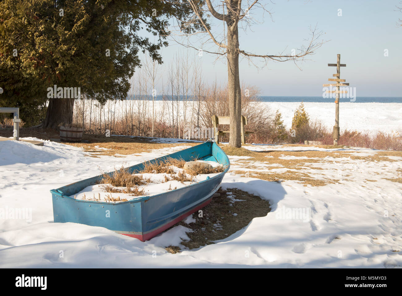 Wooden boat on shores of frozen Lake Michigan on Traverse Bay, Michigan ...