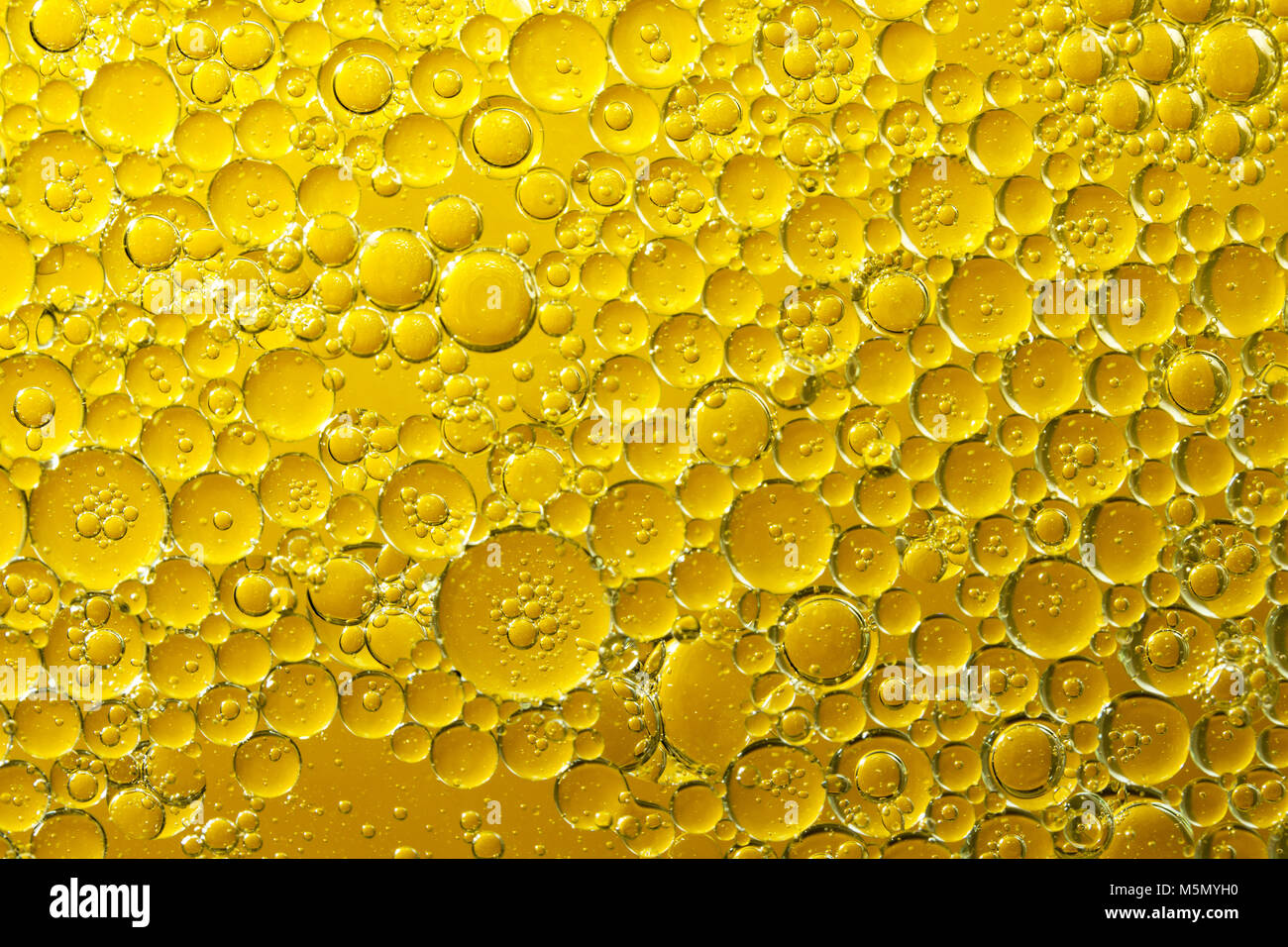 golden yellow bubble oil, abstract background Stock Photo - Alamy