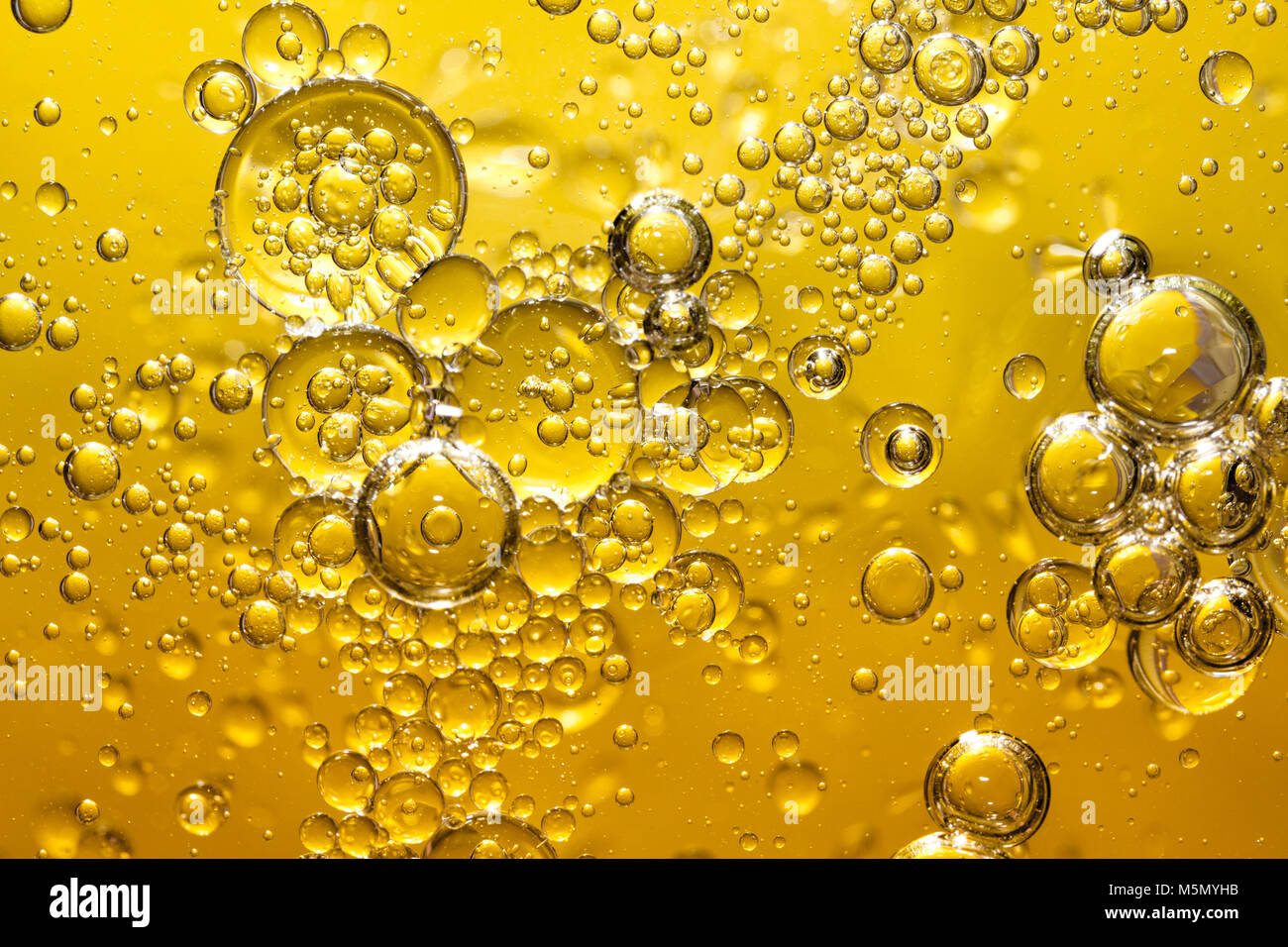 golden yellow bubble oil, abstract background Stock Photo - Alamy