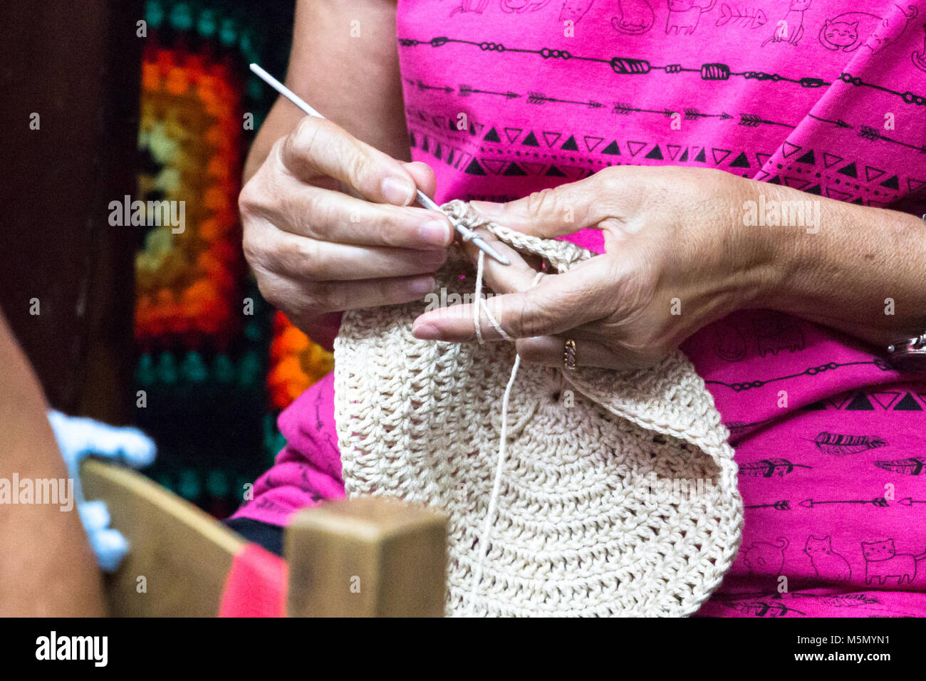 Female hands of a mature woman knitting crochet Stock Photo - Alamy