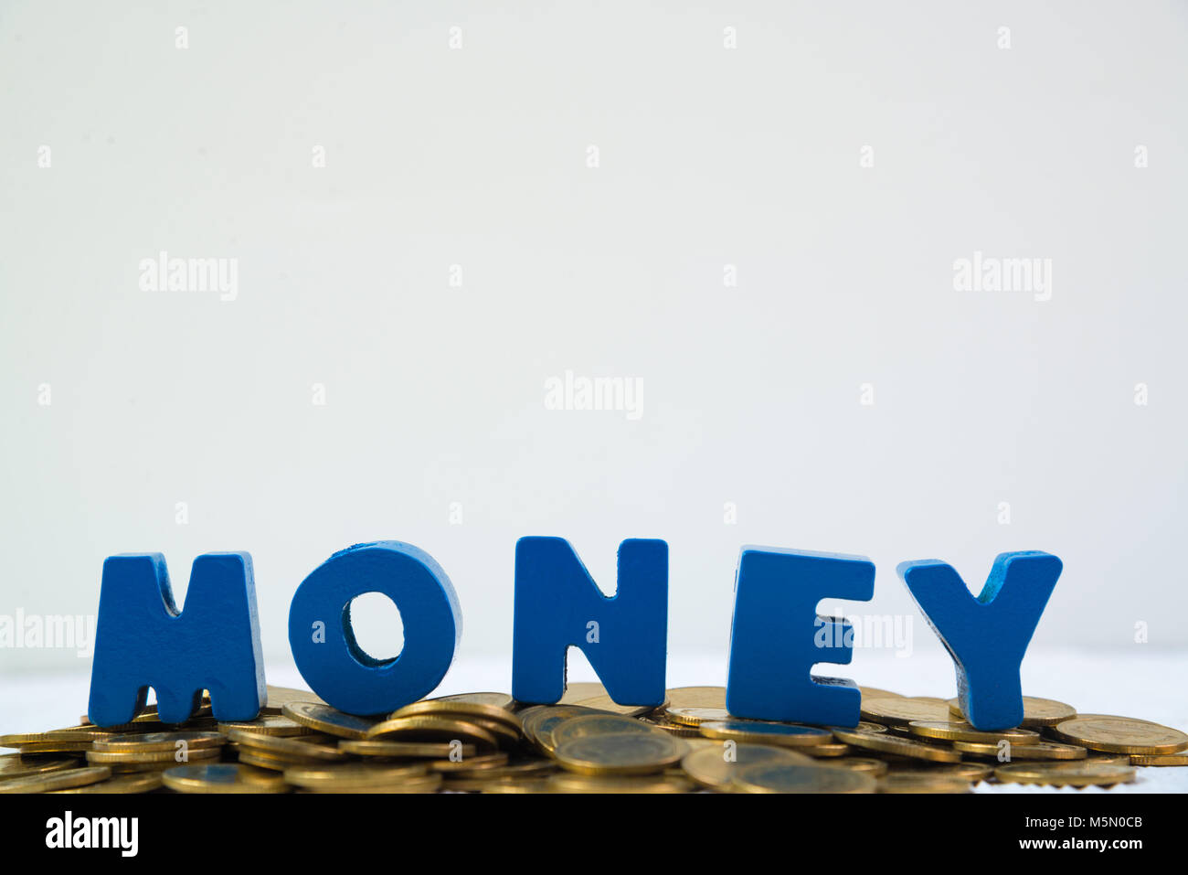 Text MONEY and stack of coin with copy space for add text, motivational ...