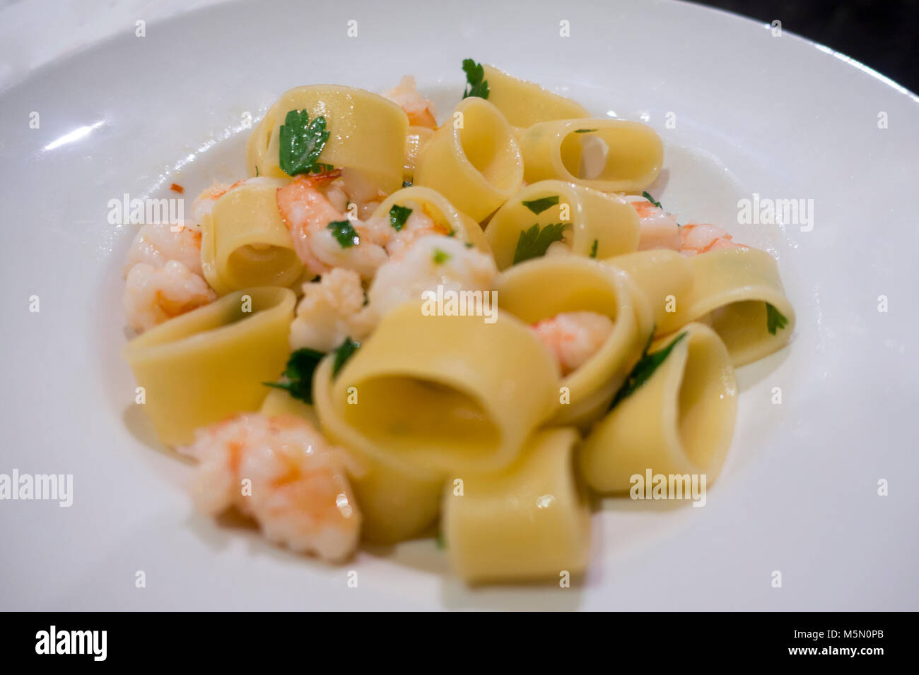 big round pasta with shrimp Stock Photo - Alamy