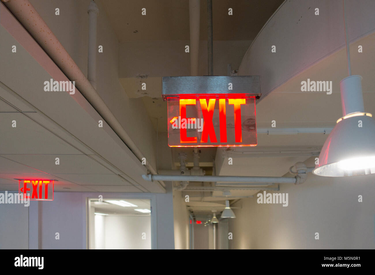 red and clear exit sign Stock Photo - Alamy