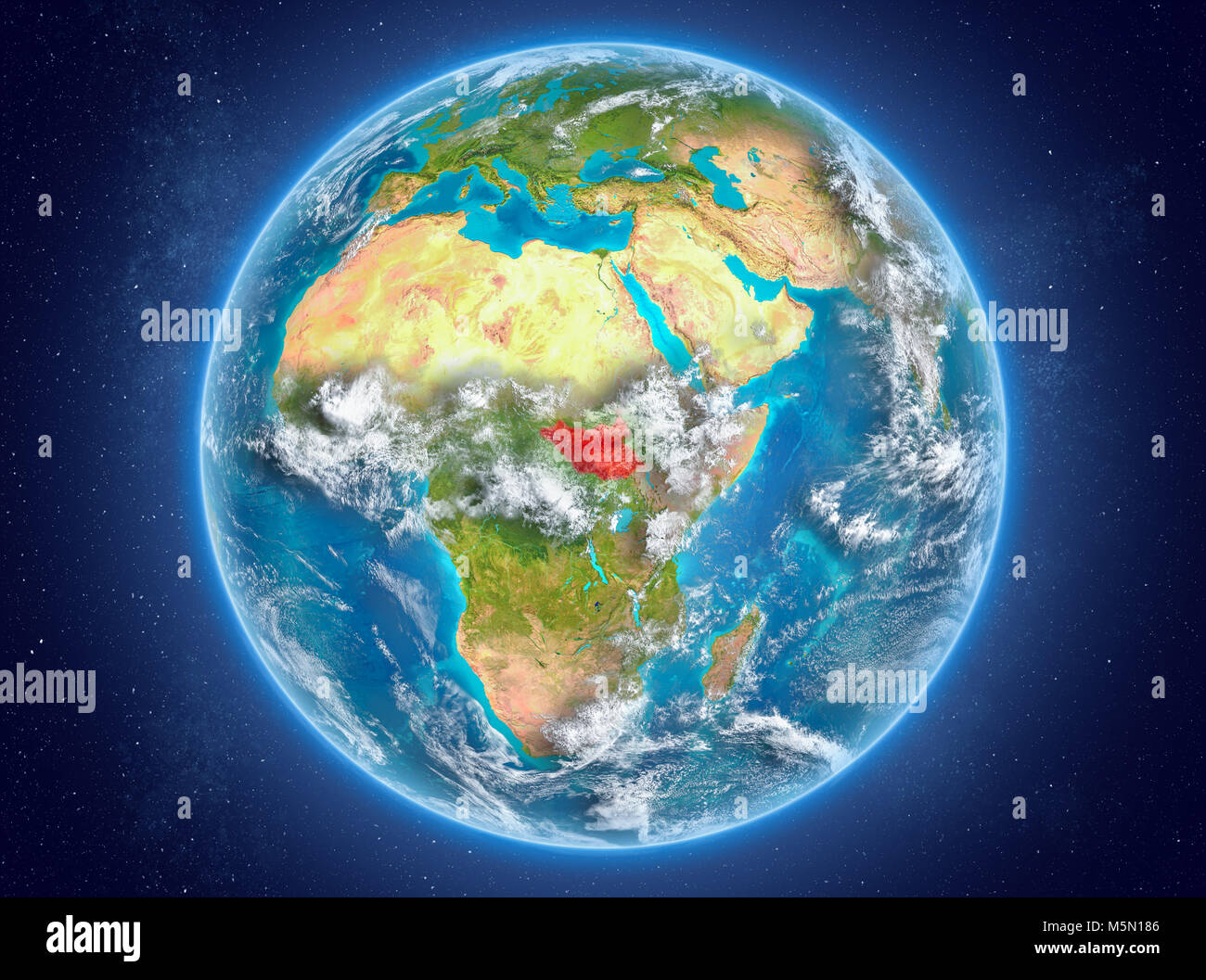 South Sudan in red on model of planet Earth with clouds and atmosphere ...