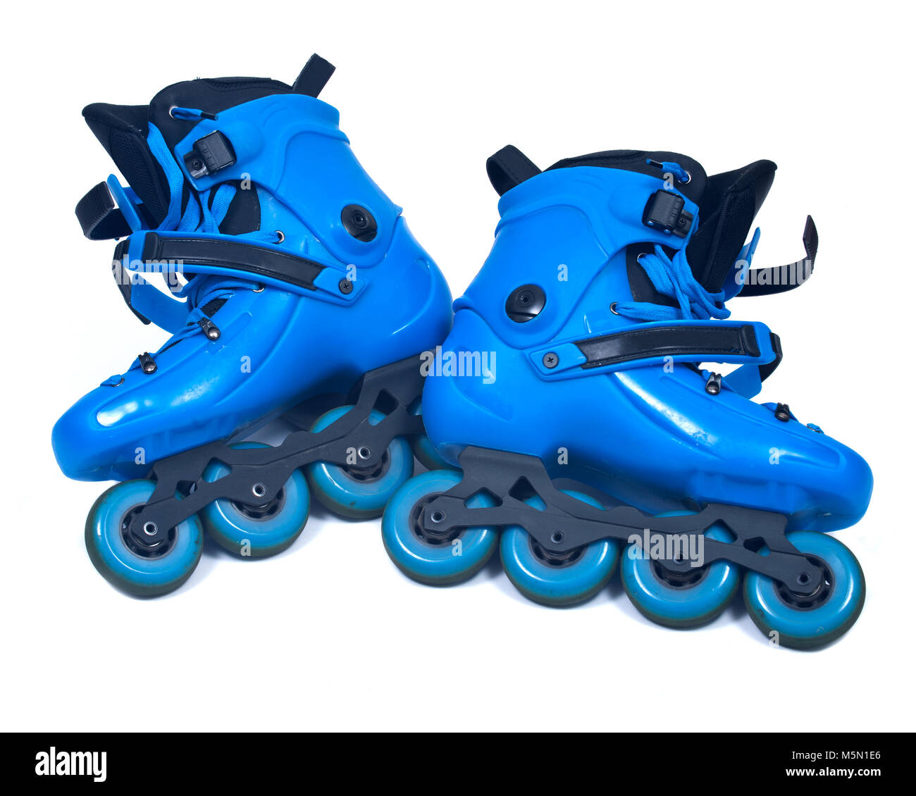 Blue roller skates isolated on white background Stock Photo - Alamy