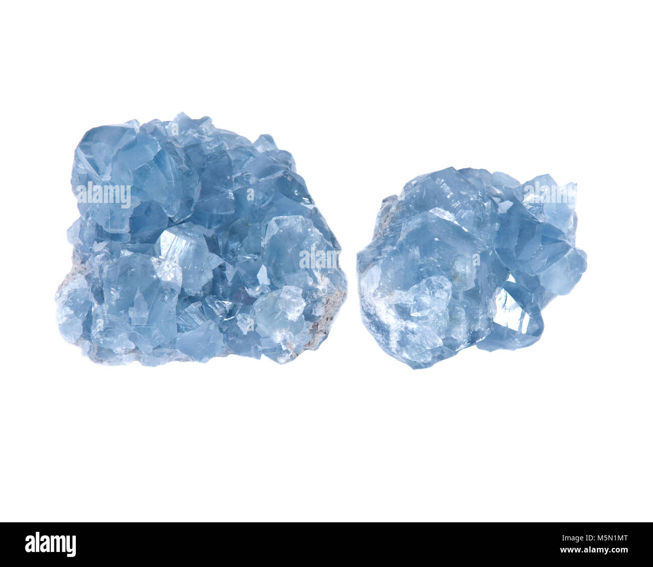 Blue celestite cluster isolated on white background Stock Photo - Alamy