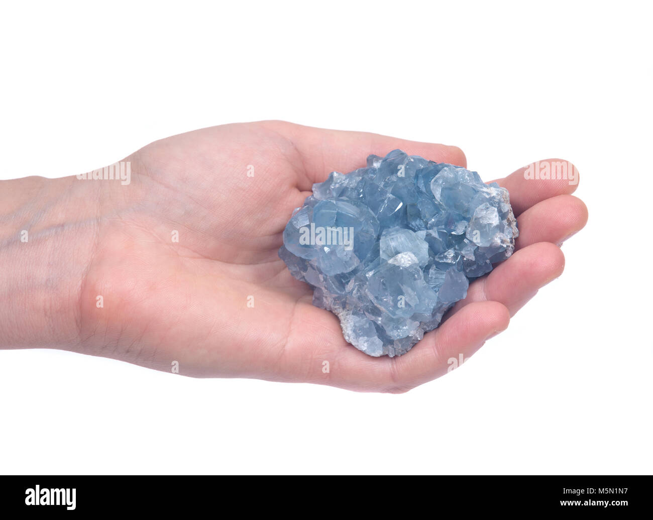 Blue celestite cluster isolated on white background Stock Photo - Alamy
