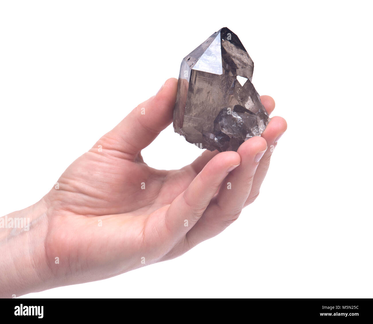 Woman's hand holding high altitude Smokey quartz (Gwindel quartz) from ...