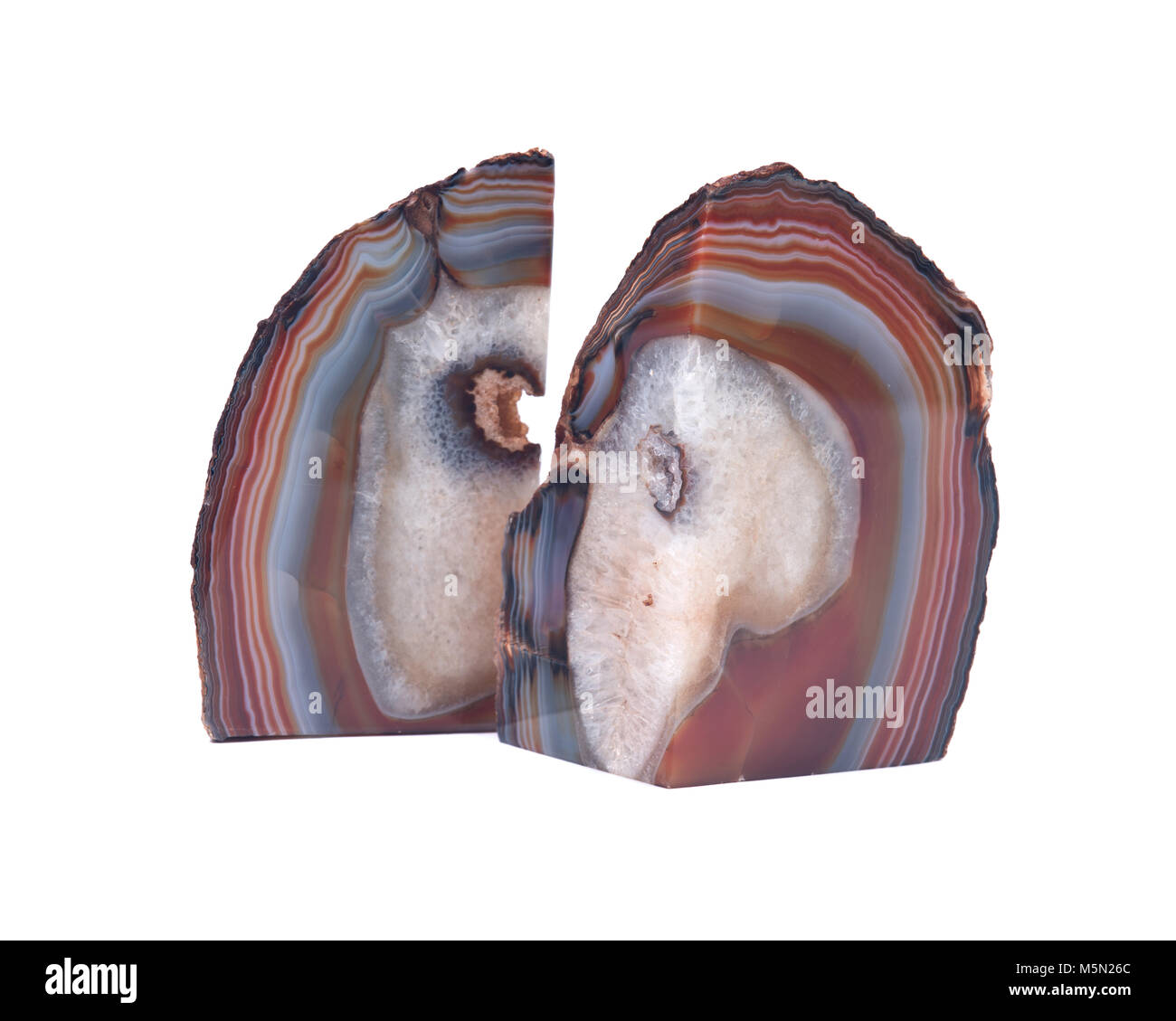 Pair of polished multicolor agate geode bookends isolated on white ...