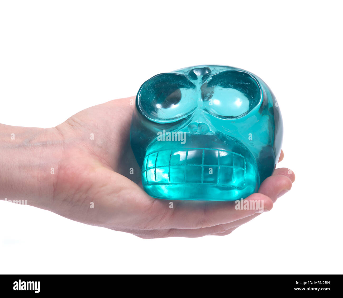 Blue green obsidian skull isolated on white background Stock Photo - Alamy