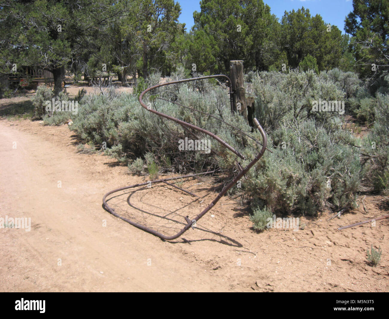 view from SW damaged gate at entrance road PW RS . This photo is part ...