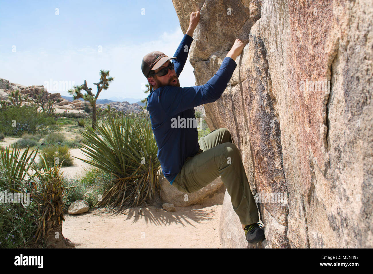 Bouldering on Gunsmoke, a popular boulder problem Stock Photo - Alamy