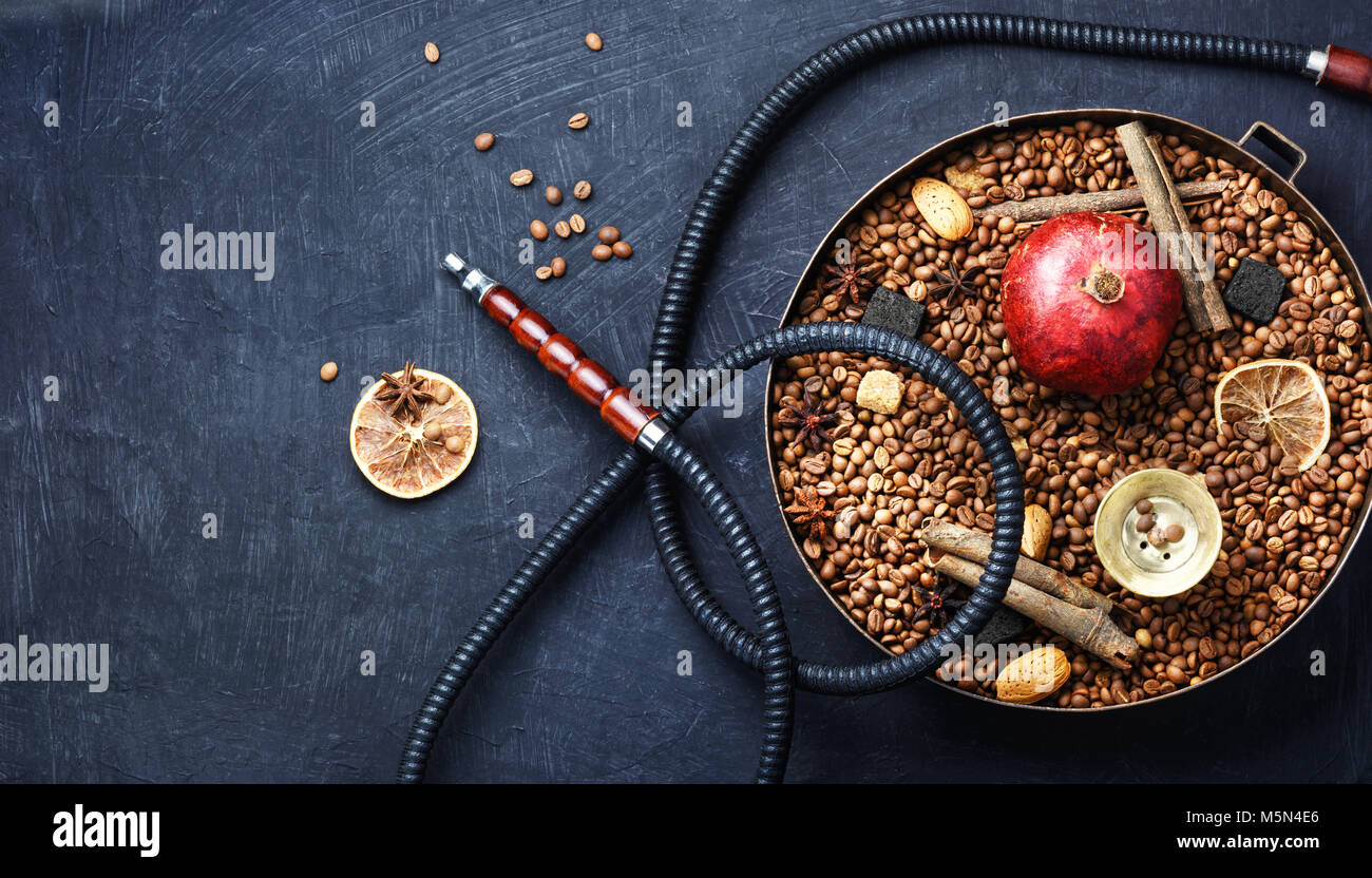 Shisha hookah with with coffee beans and pomegranate.Shisha concept ...