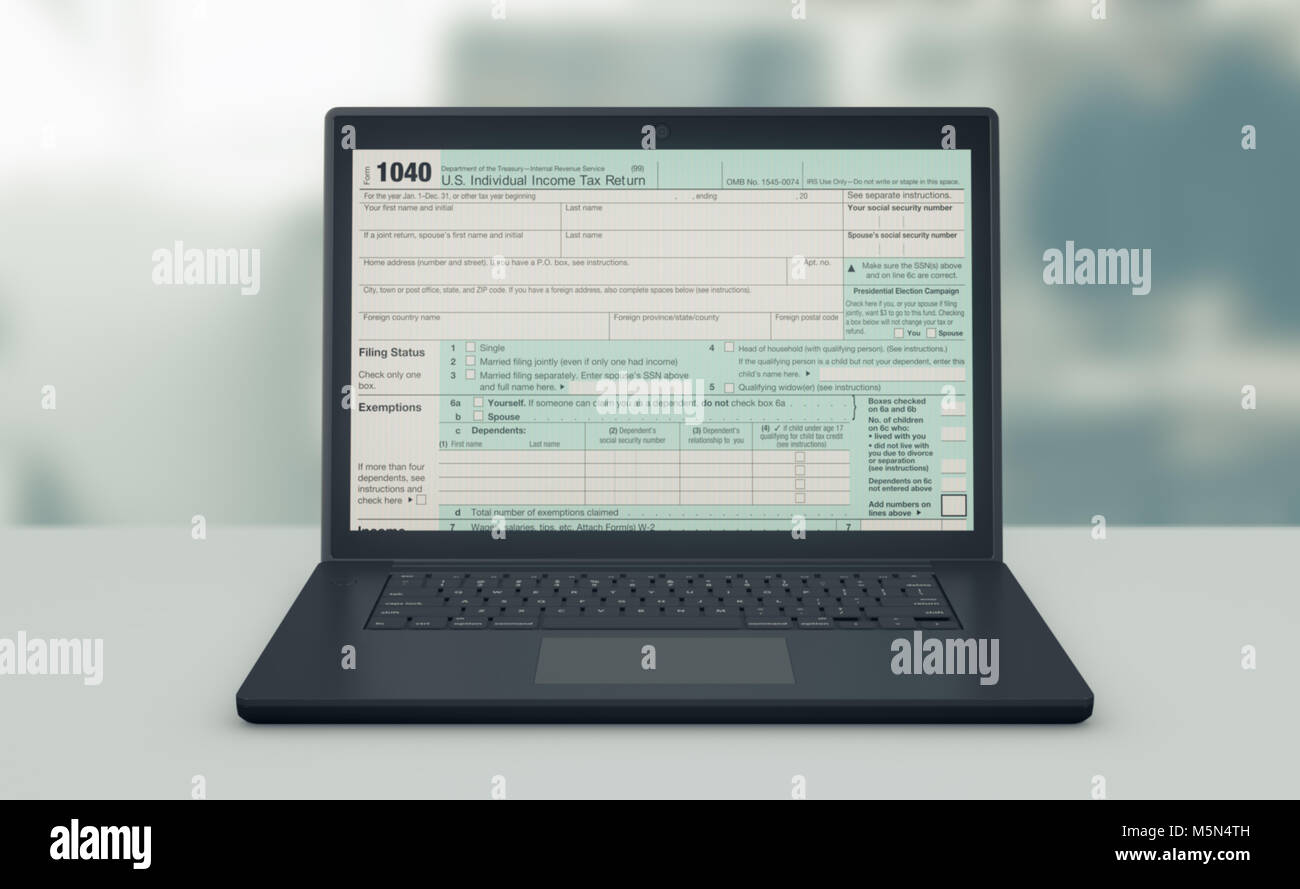front view of a computer laptop with a tax form on screen, concept of ...