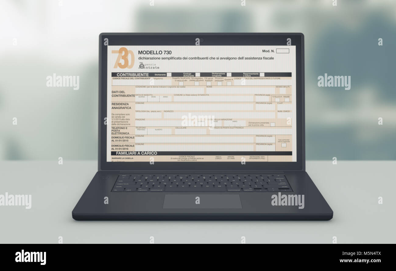 front view of a computer laptop with a tax form on screen, concept of ...