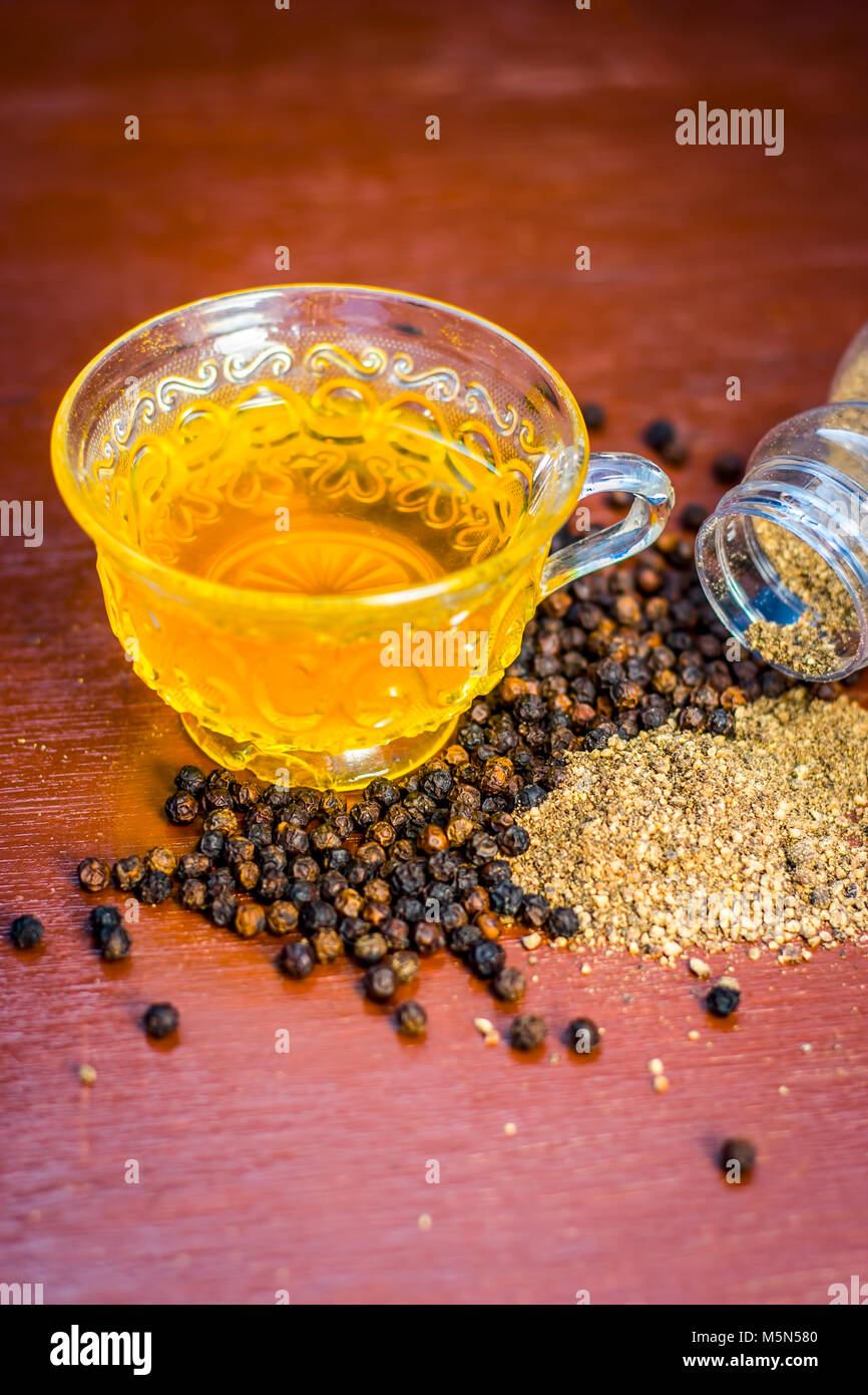 Tea of black pepper,Piper nigrum with raw black pepper and powdered ...