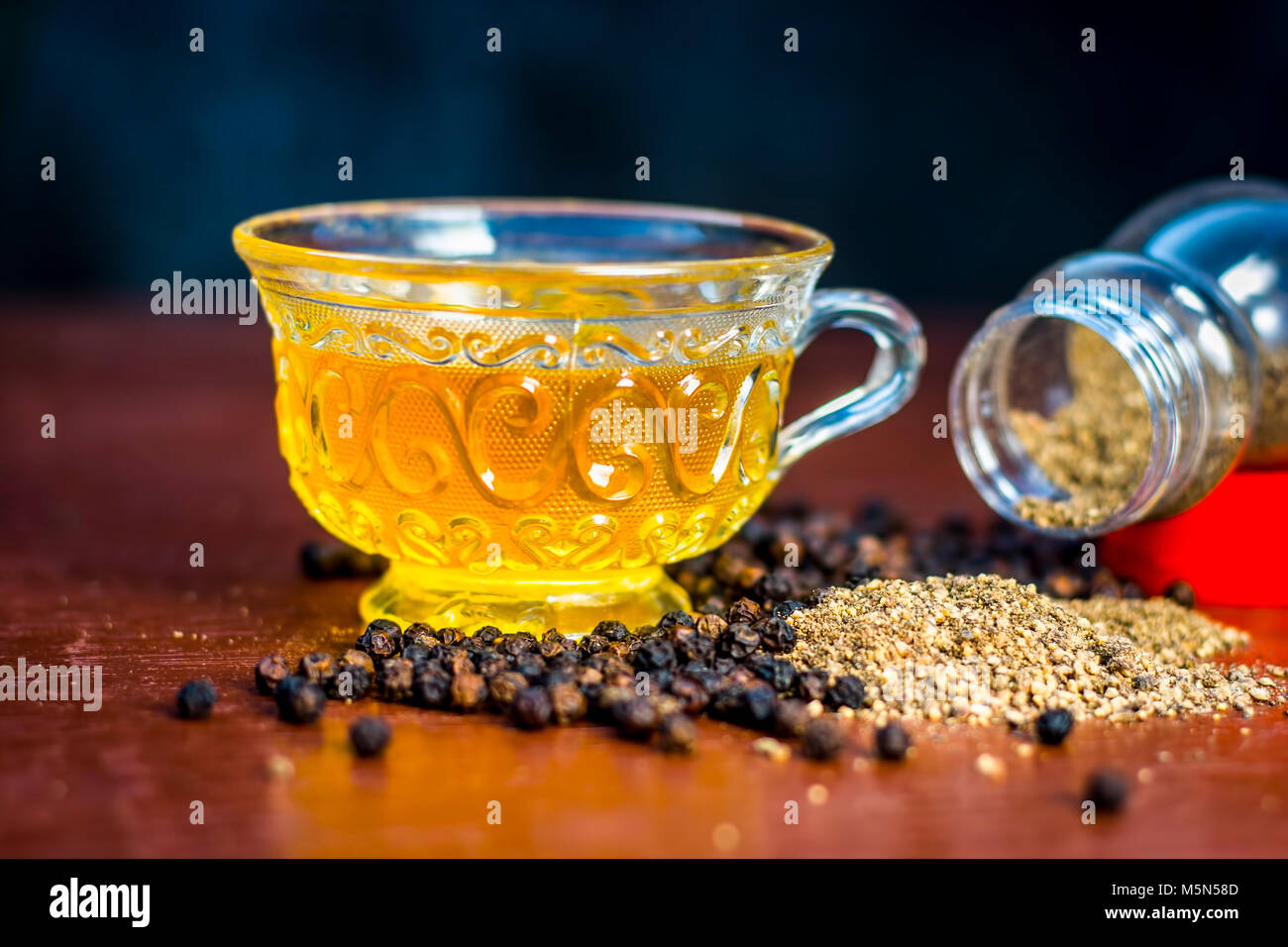 Tea of black pepper,Piper nigrum with raw black pepper and powdered ...