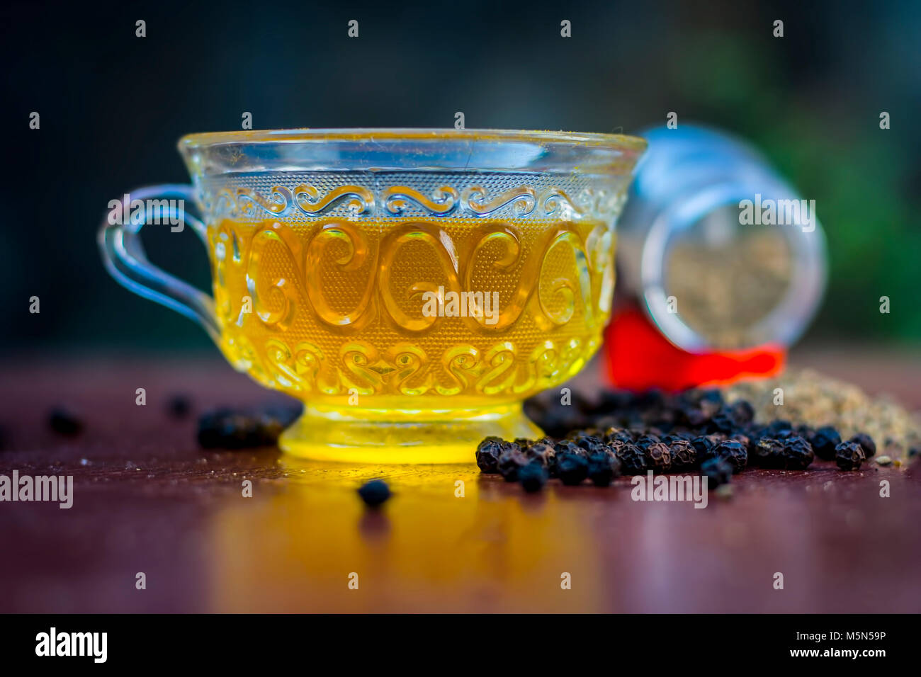 Tea of black pepper,Piper nigrum with raw black pepper and powdered ...