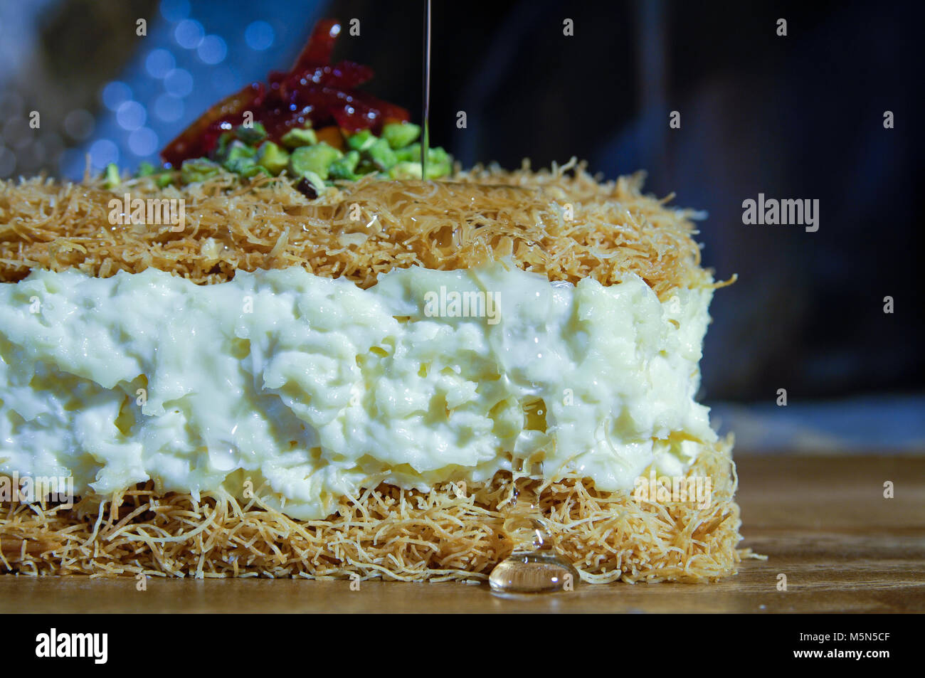 Pouring Syrup on Osmaliya, Arabic Sweets with Cream for Ramadan and Eid ...