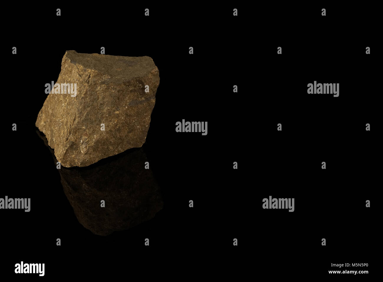 Manganese ore mineral isolated on a black background. Pyrolusite. Rocks ...