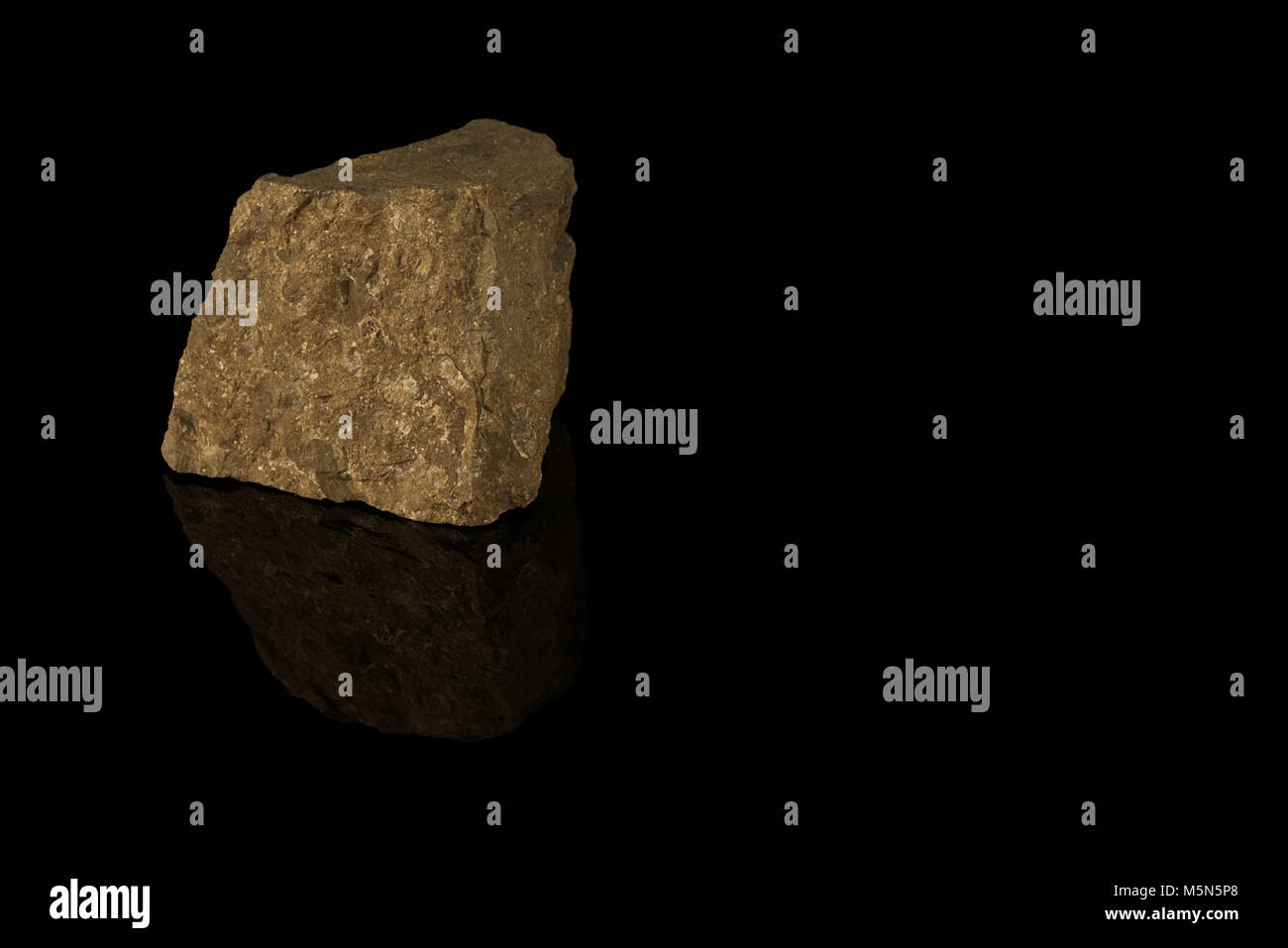 Manganese ore mineral isolated on a black background. Pyrolusite. Rocks ...