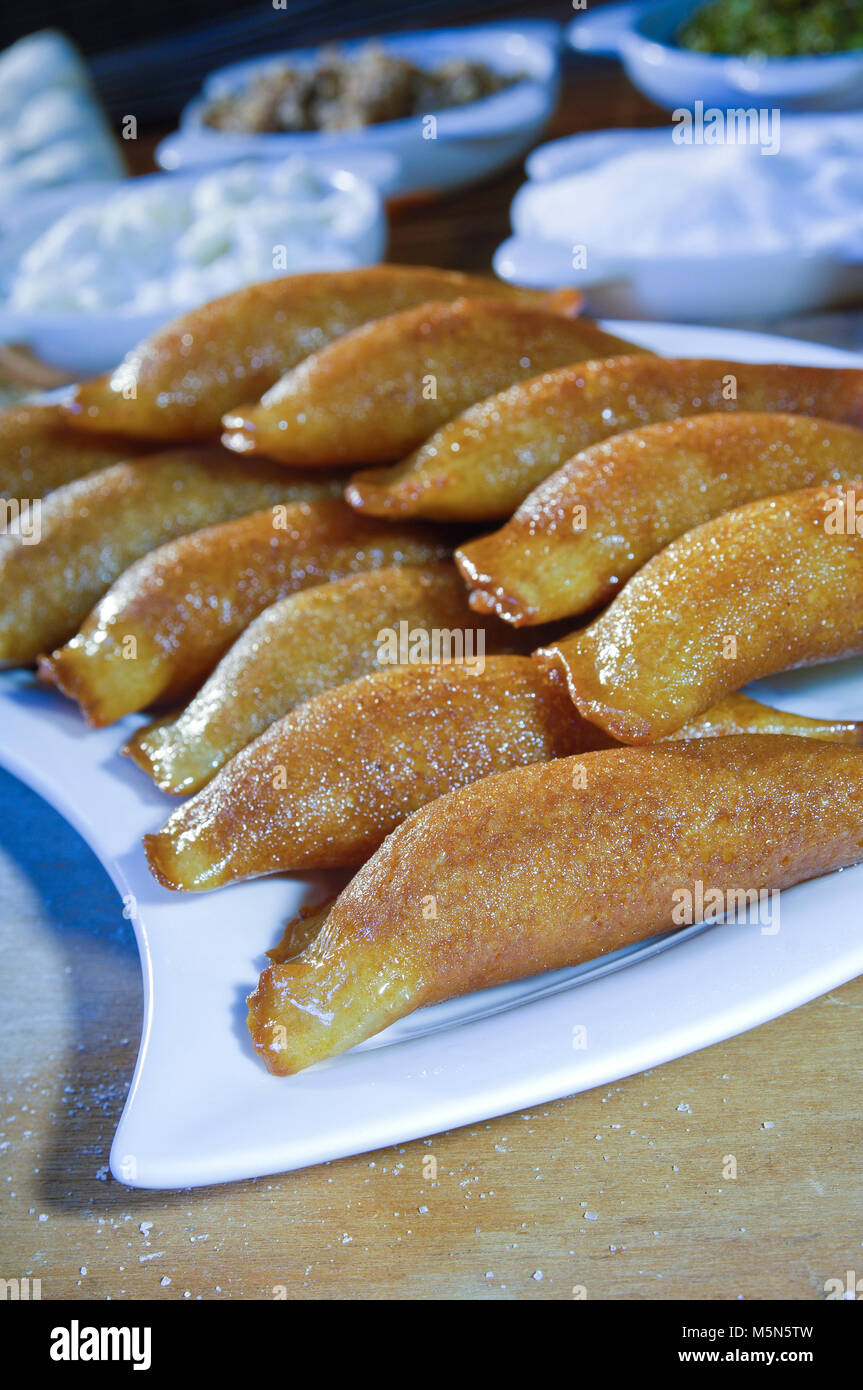 Traditional qatayef sweets hi-res stock photography and images - Alamy