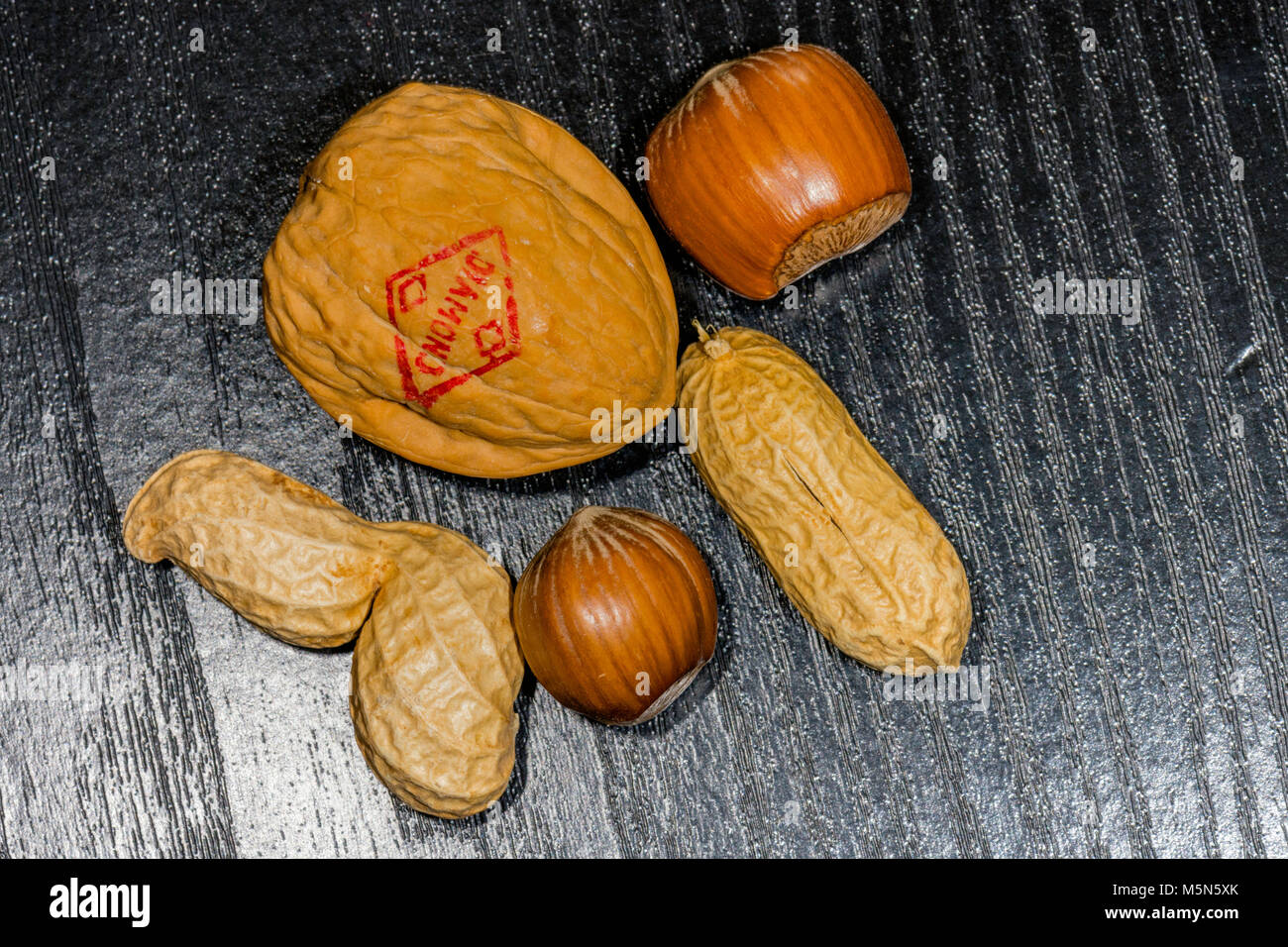 Selection of common nuts Including Walnut, Peanut and Hazel Nut Stock ...