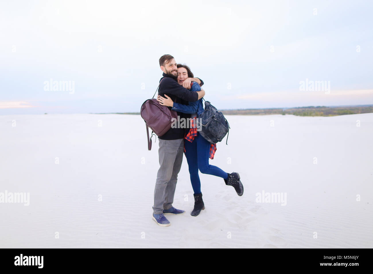 Presenters of travel program married couple viewing map Stock Photo - Alamy
