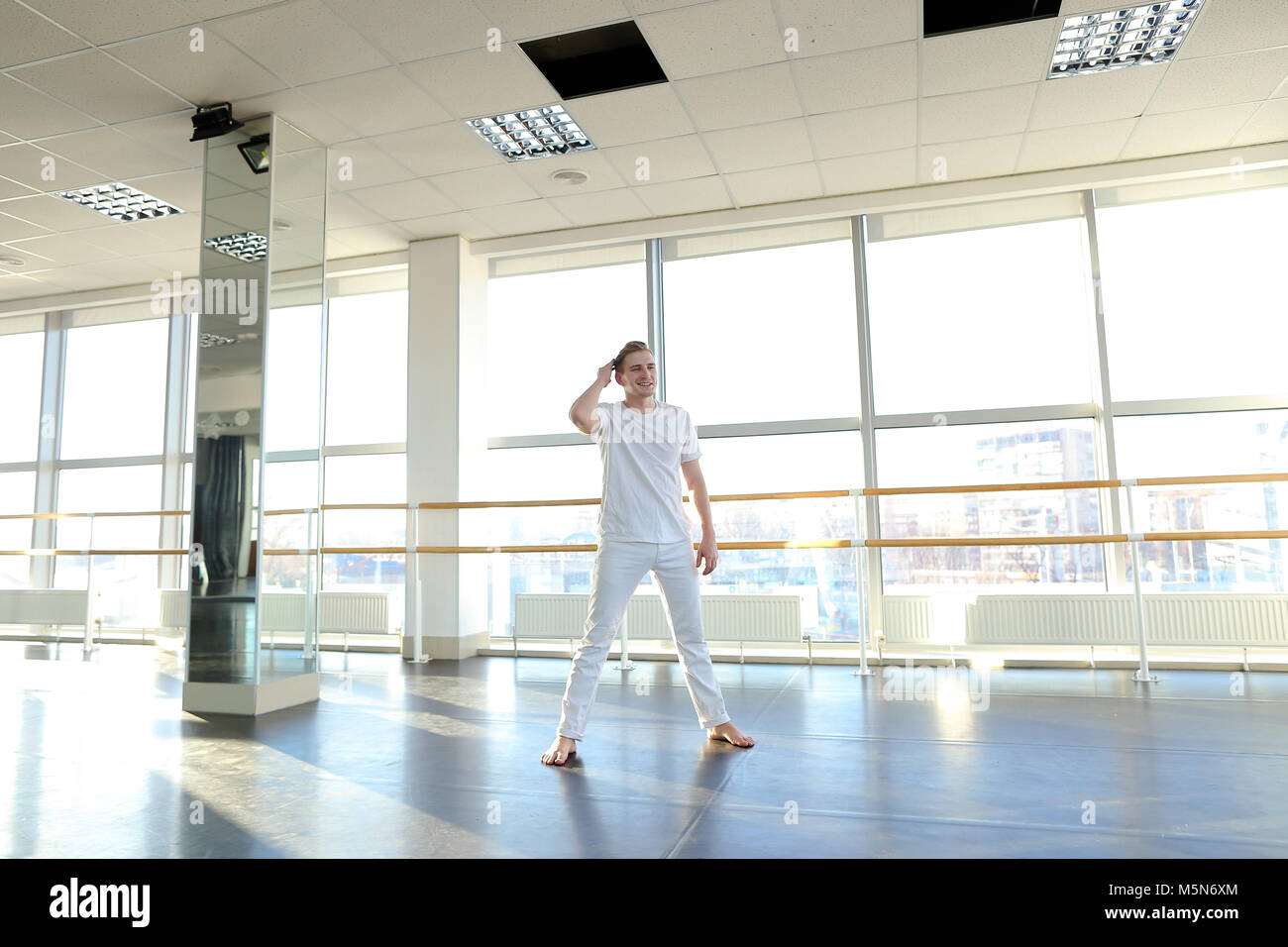 Blonde guy spotting at studio Stock Photo - Alamy