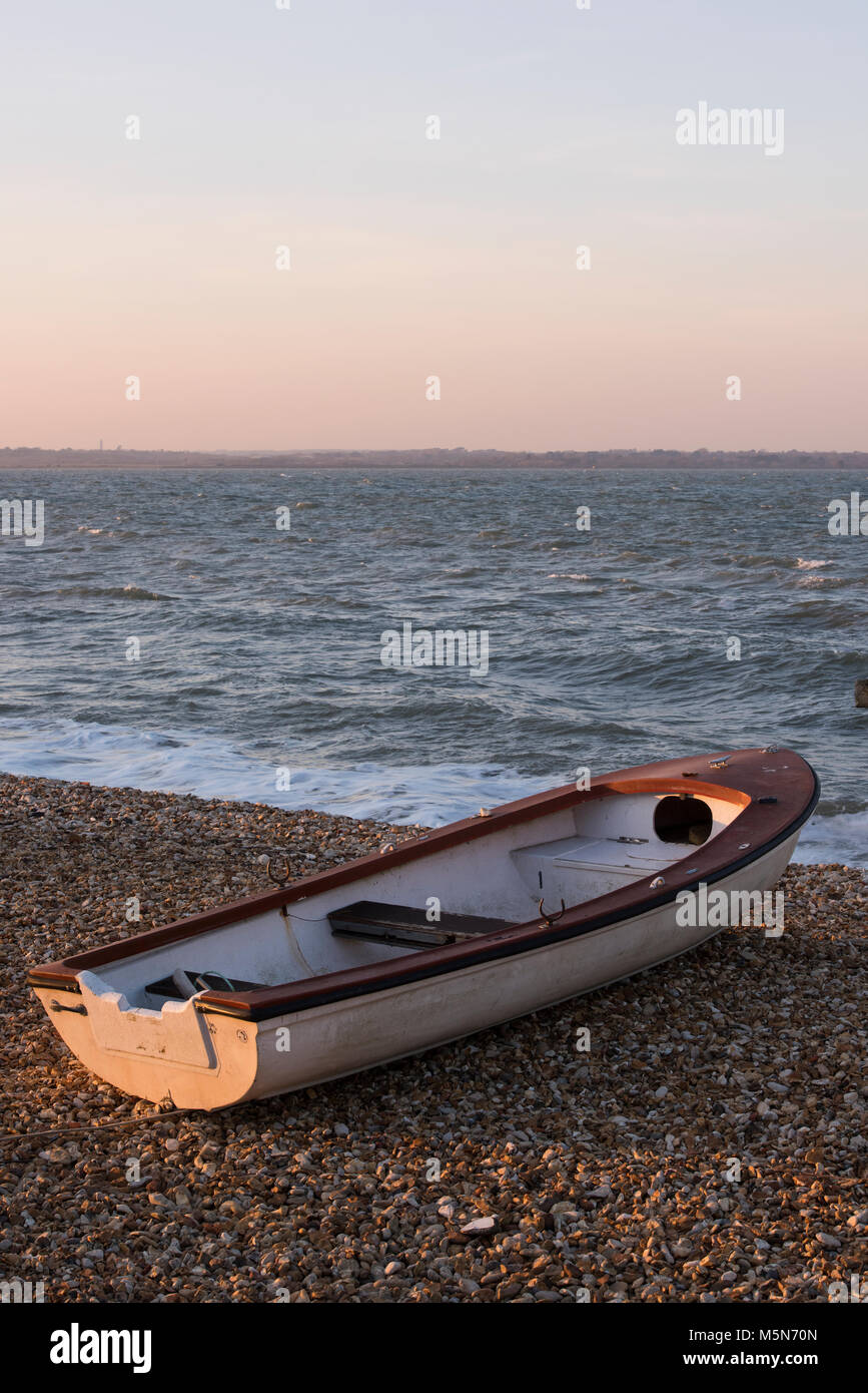 small dinghy washed up on the beach on the isle of wight coastline at ...