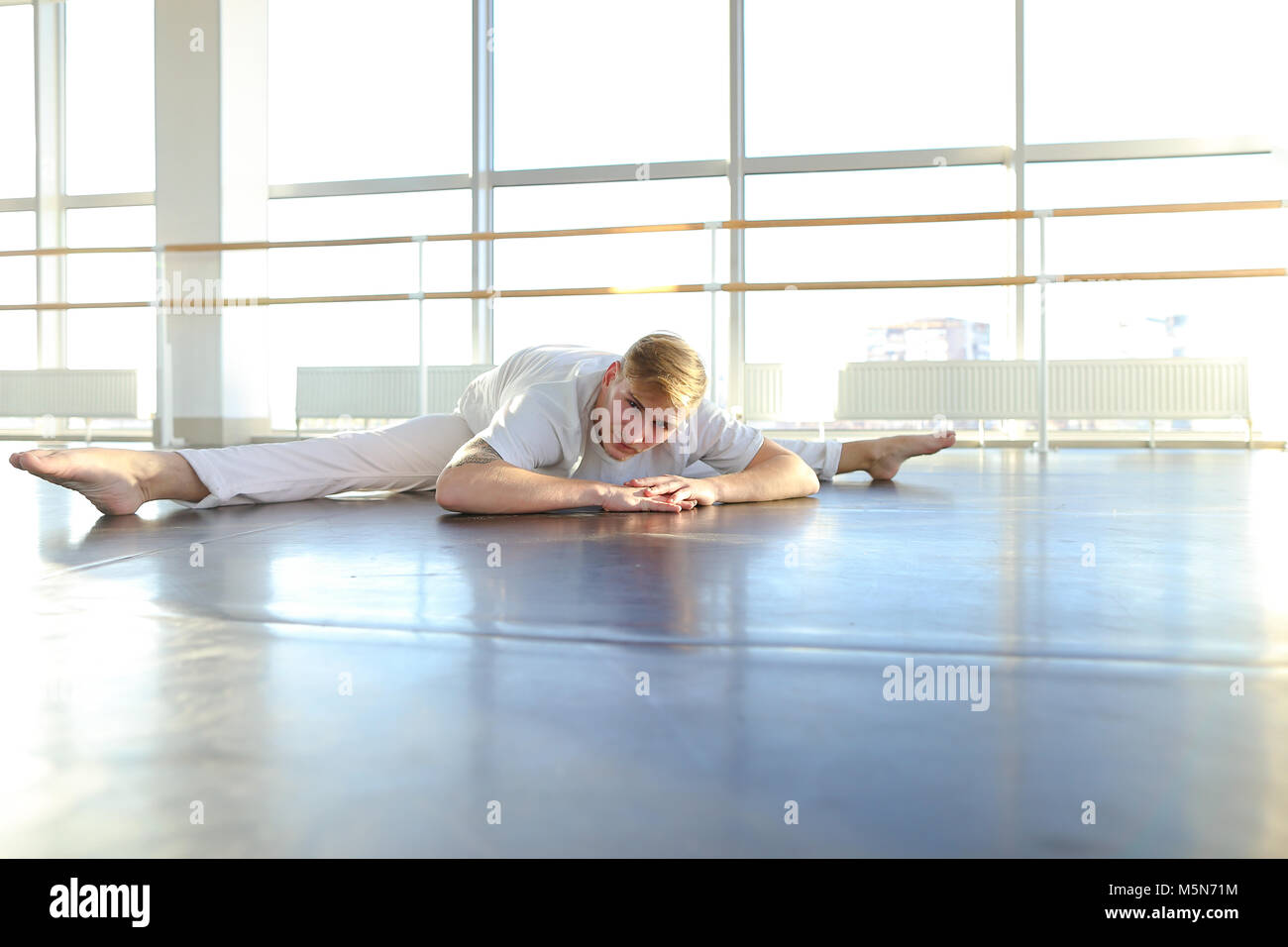 Dance trainer doing backwards close up somersault Stock Photo - Alamy