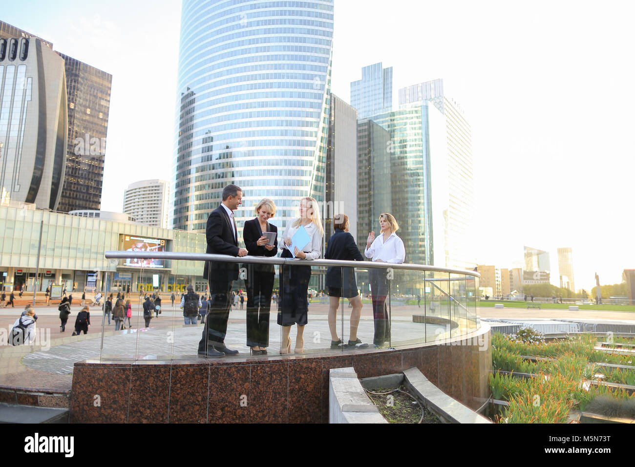 Businesswomen speaking with male boss outside Stock Photo - Alamy